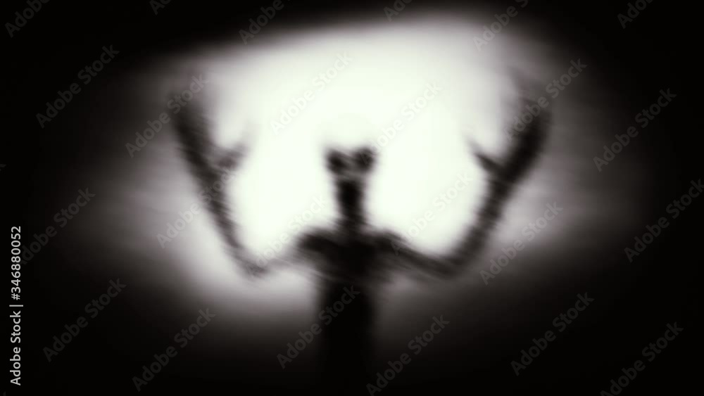 Scary dark room in alien spaceship and the silhouette of an humanoid ...