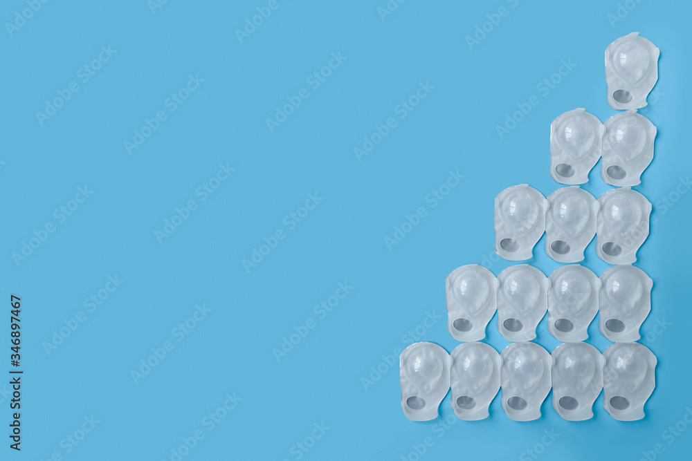 Pyramid of lenses. Contact lens blisters lie at the edge of the frame ...