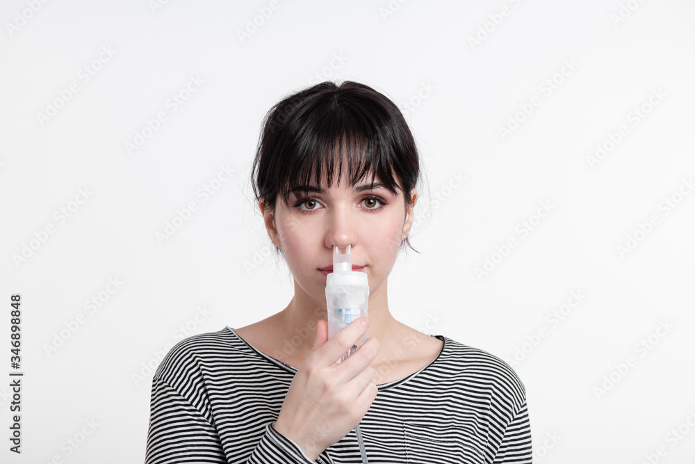 profile picture of brunette woman using nasal inhaler. patient inhale ...