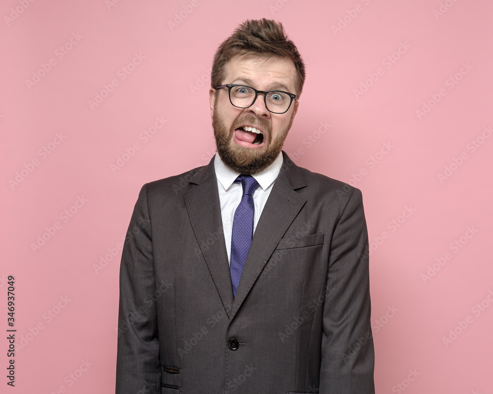 Crazy man in glasses and a suit with an open mouth and a strange ...