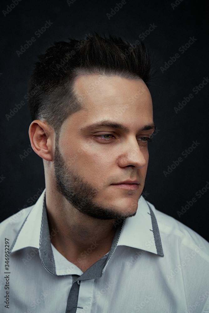 ortrait of handsome young man against studio background. Perfect ...