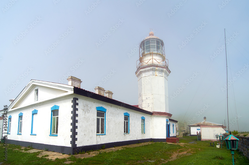 Old lighthouse in the fog on a rock. Gamow Lighthouse on the Gamow ...