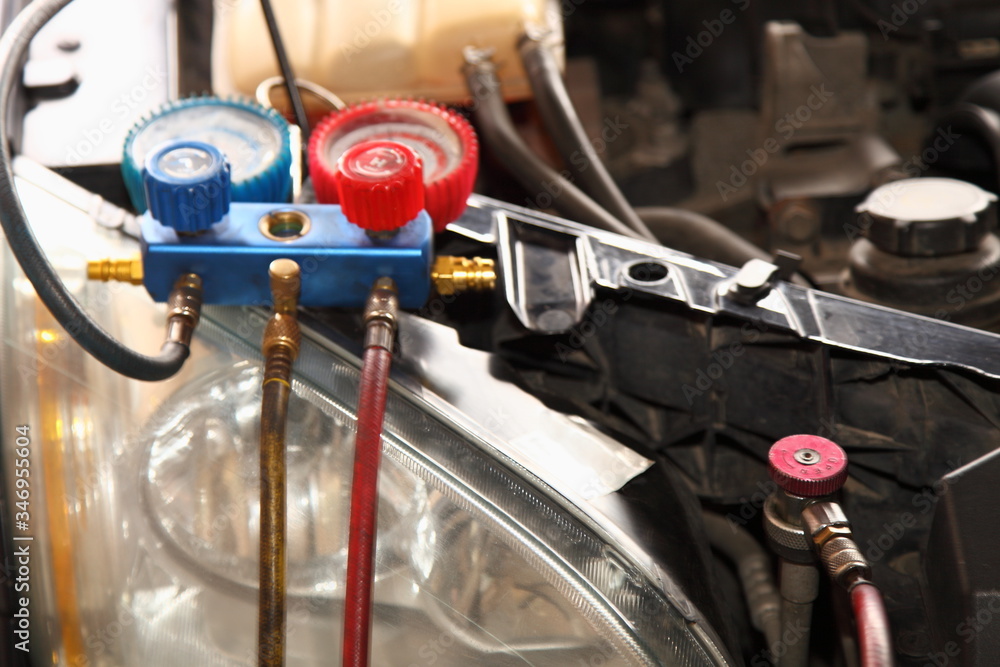 Car A/C testing installationt, red and blue valves with manometers and ...