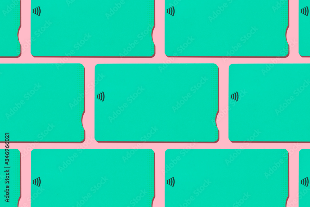 Mint green contactless credit cards pattern on pastel pink background ...