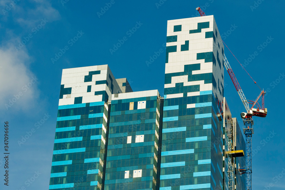 SINGAPORE, building a base of a new skyscraper using cranes Stock Photo ...