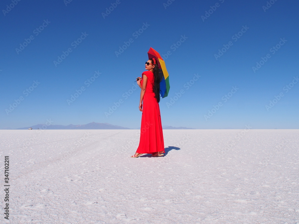 Girl model with long black hair in the red long dress, Uyuni Salt Flat ...