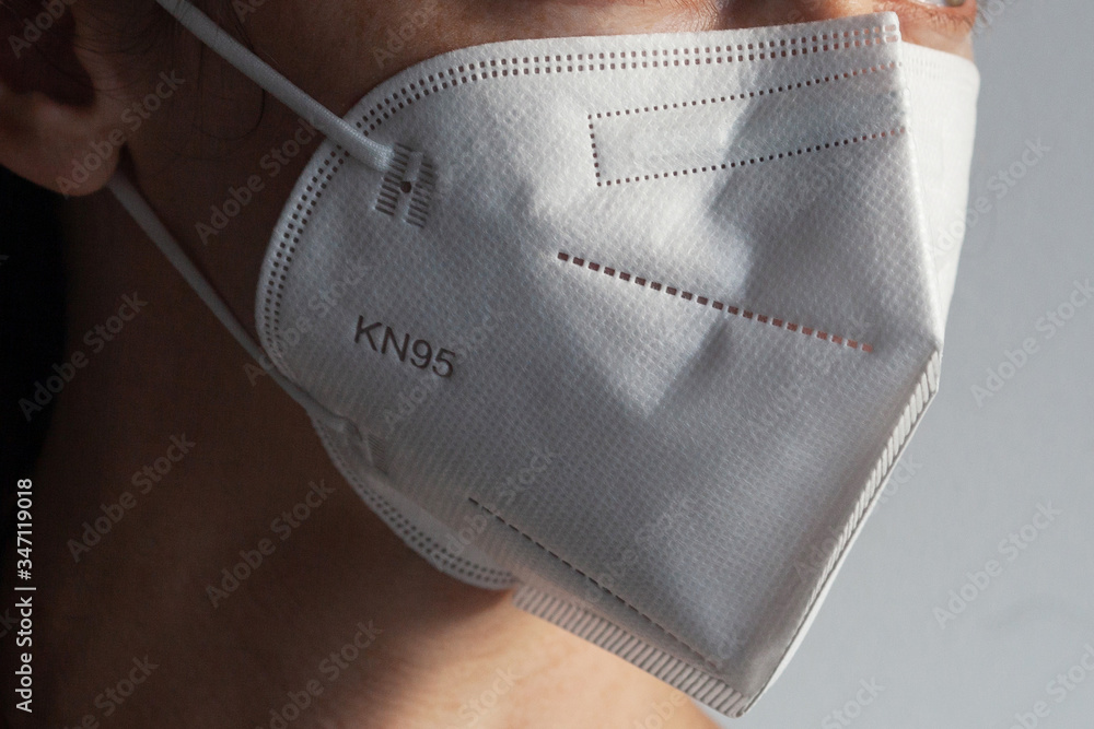 Young woman wearing KN-95 protection medical mask. Prevention of the ...