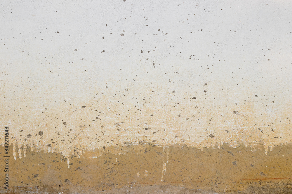 Concrete wall texture with unfinished paint job and mud stain. Stock ...