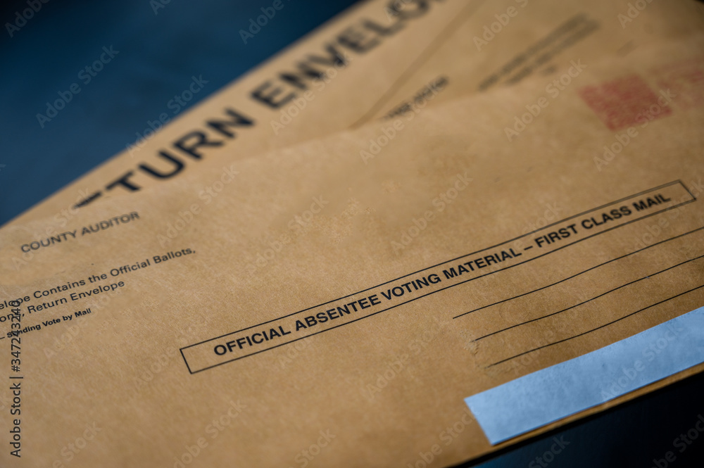 Selective focus on brown official absentee ballot voting material ...