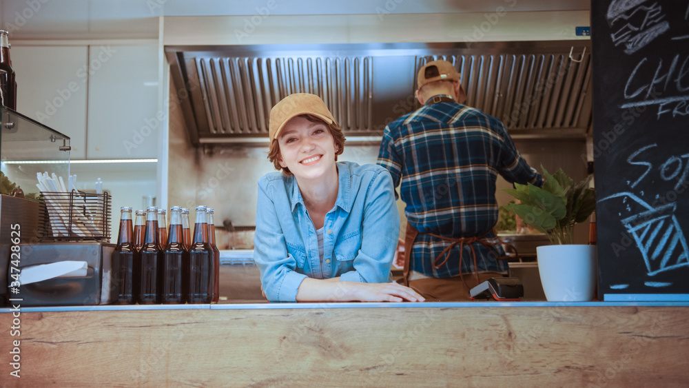 Food Truck Female Employee Smiles and Looks at the Camera. Street Food ...