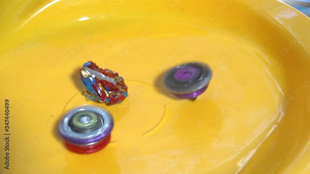 Collective image of the children's popular toy Beyblade. The battle of ...