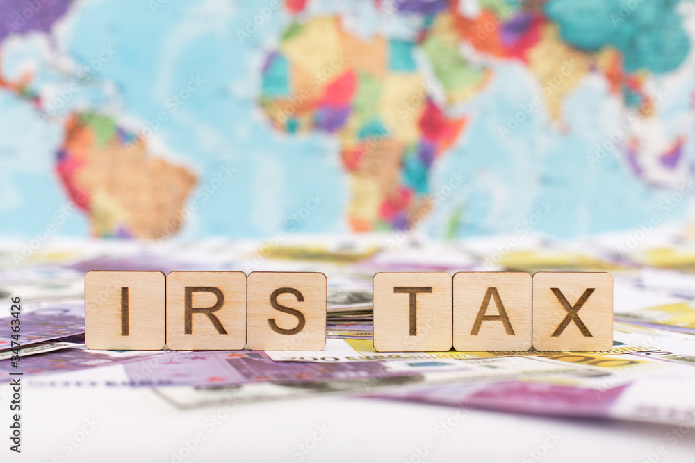 Wooden sign irs tax made of wooden alphabet letters, working concept ...