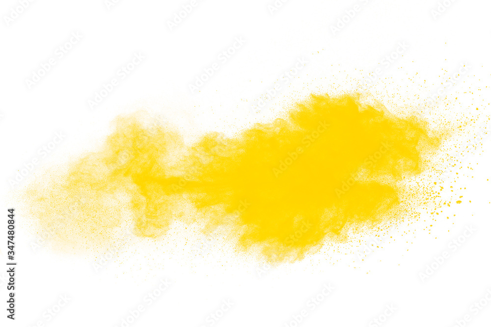 Yellow dust particles explosion on white background.Yellow powder dust ...