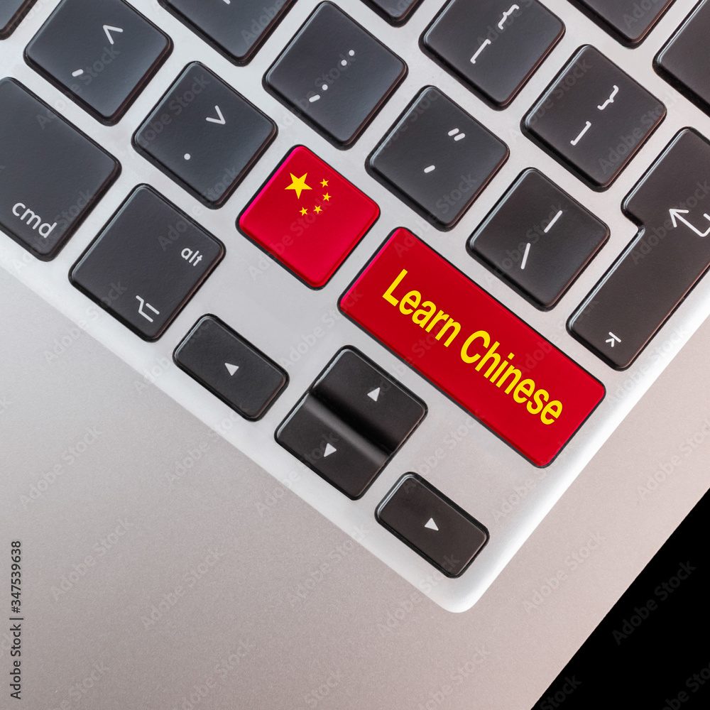 Learn Chinese Concept. Closeup of keyboard with Chinese flag and text ...