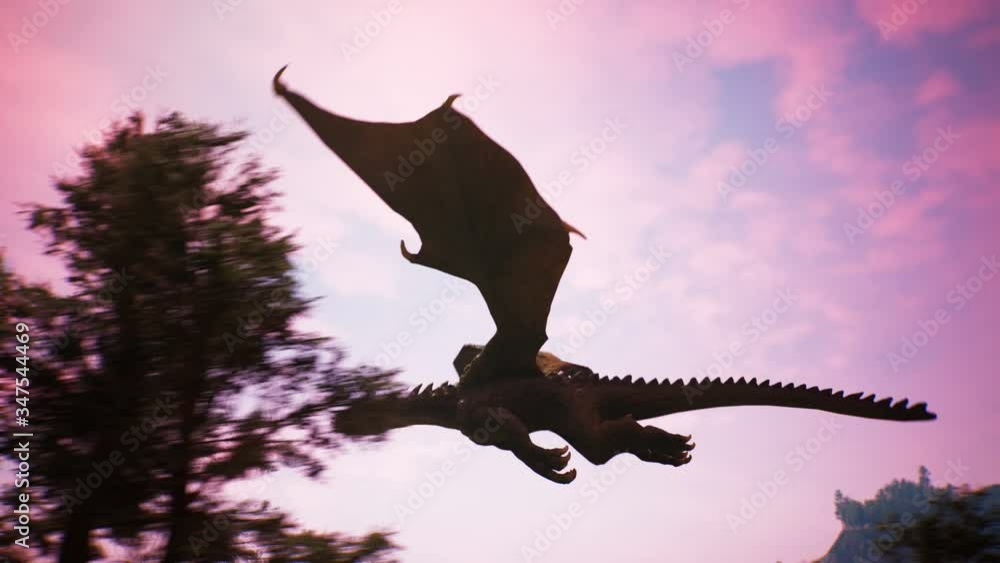 Realistic big dragon flying in the sky over the evening forest ...