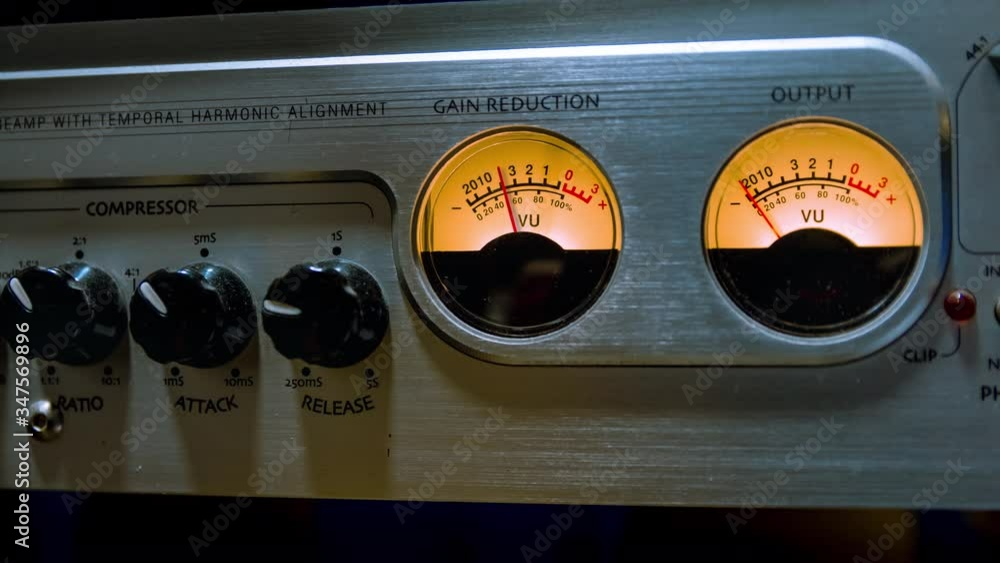 Cinemagraph of an analog VU meter moves in sync with sound level. Close ...