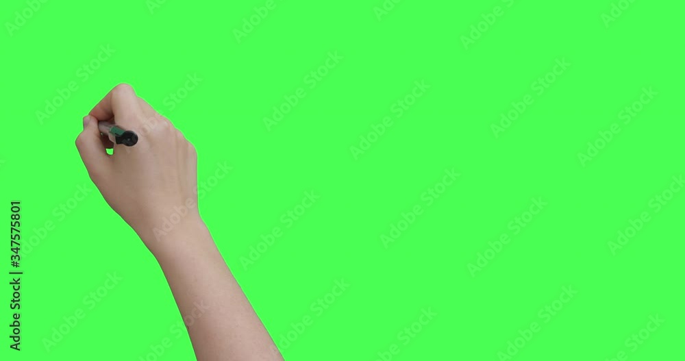 Human female hand writing something. Daylight. Green screen background ...