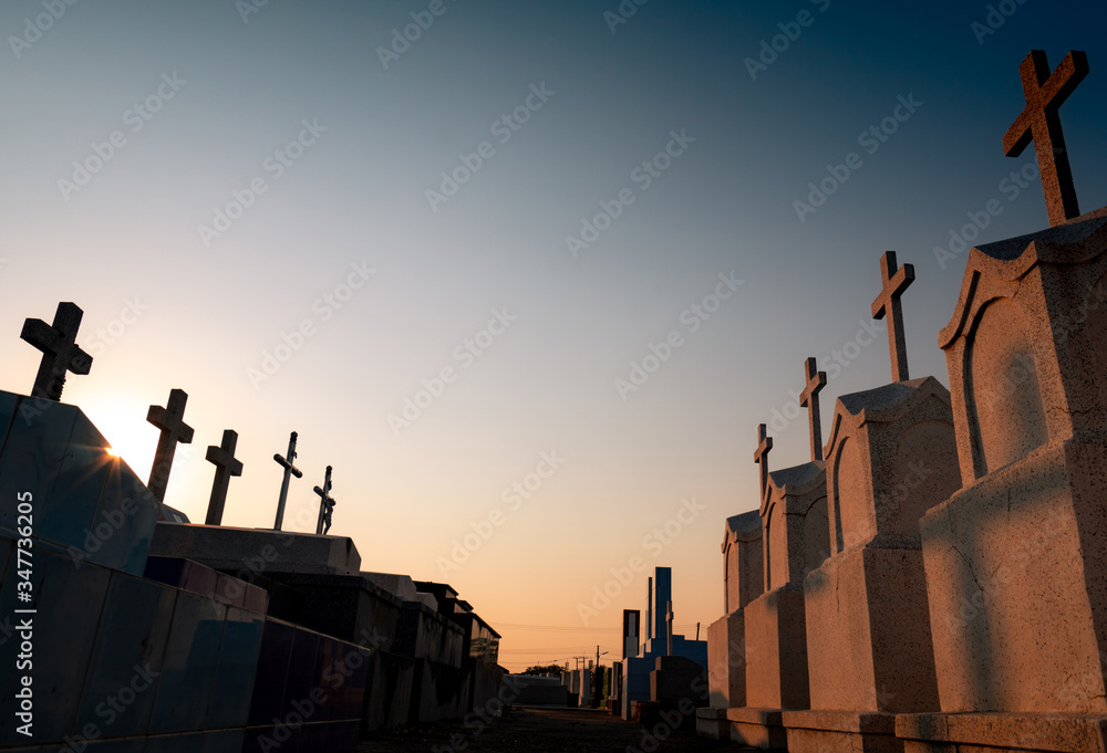 Cemetery or graveyard in the evening with sunset sky. Headstone and ...