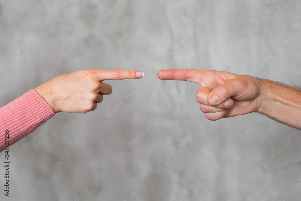 Man and woman's fingers pointing at each other Stock Photo | Adobe Stock