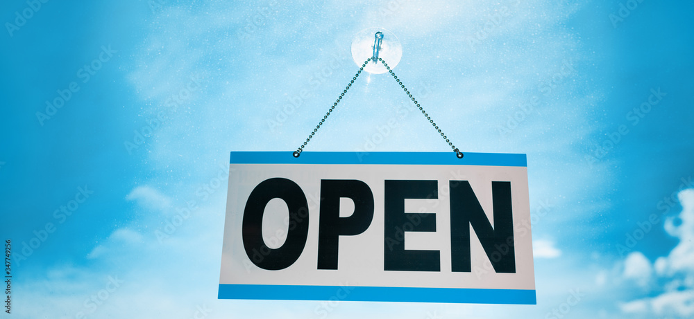 COVID-19 end of confinement stores reopening with OPEN sign hanging on ...