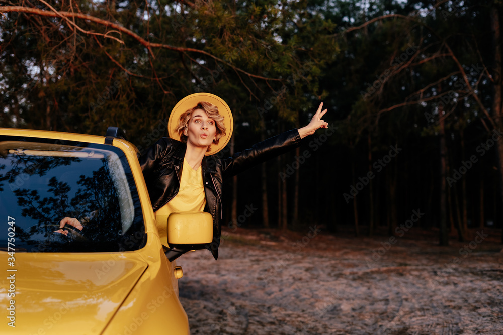 Caucasian Funny Woman Leaning out of Car Window. Beautiful Girl have ...