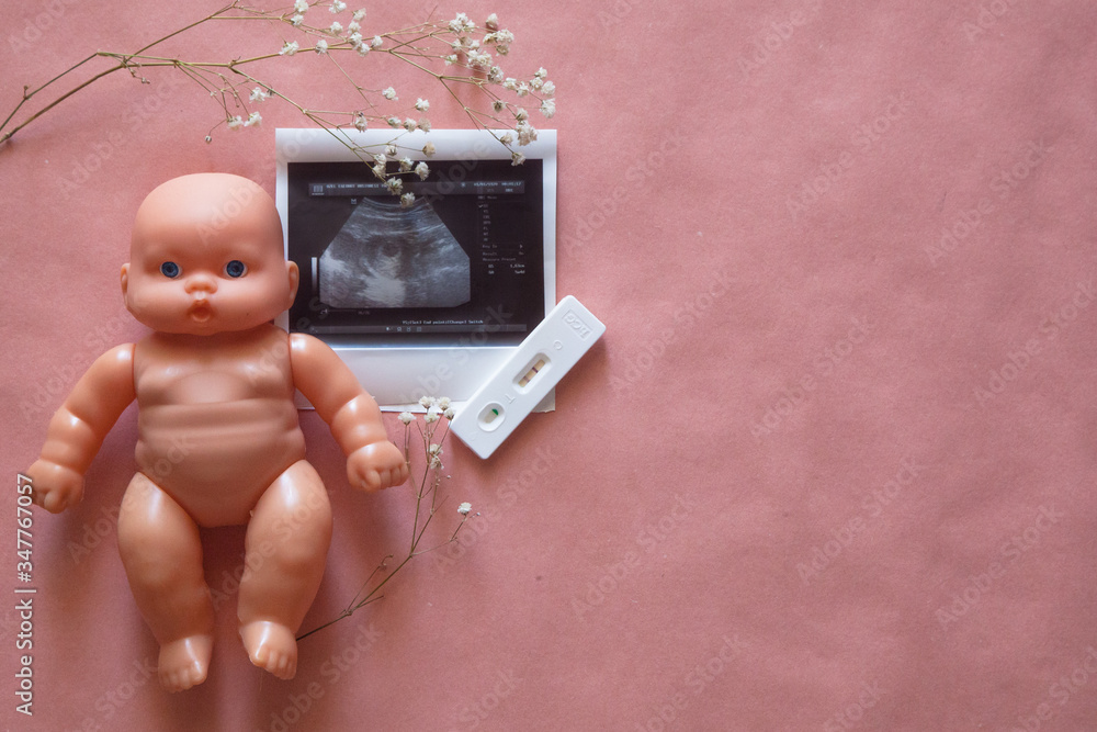 Ultrasound scan of an unborn baby of fifth week with a pregnancy test ...