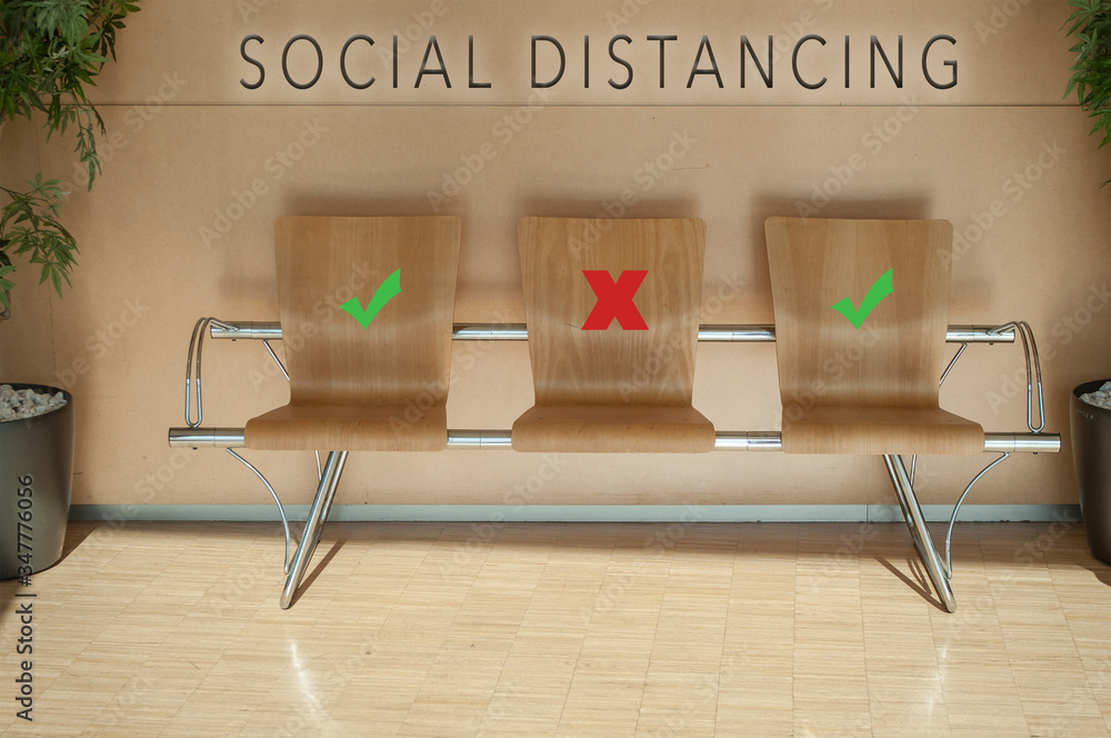 Brown chair alignment in a waiting room with symbol on seat for the ...