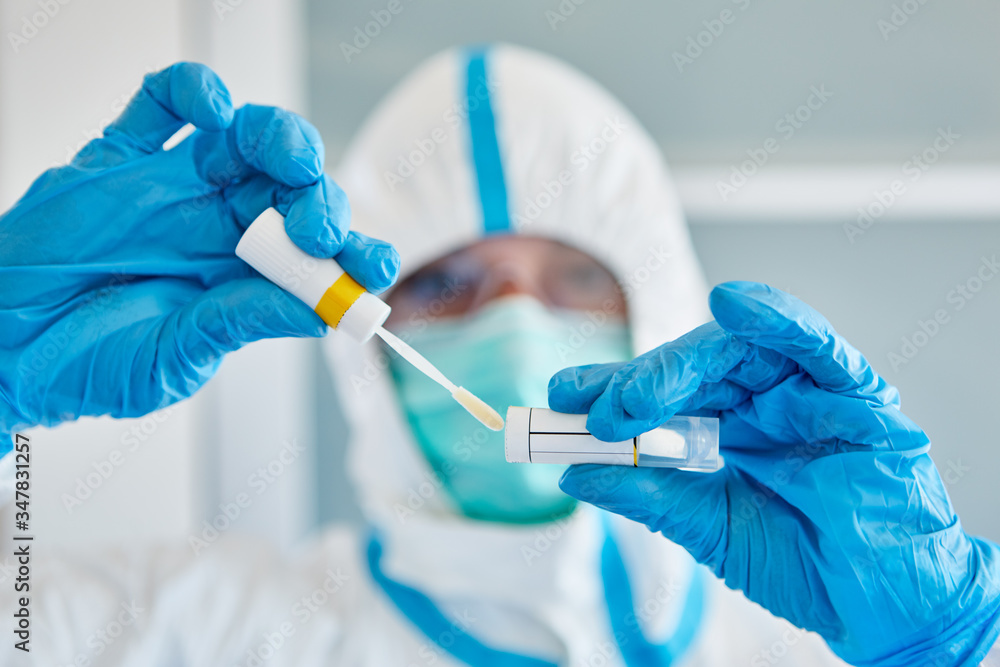 Throat swab on saliva sample for coronavirus test Stock Photo | Adobe Stock