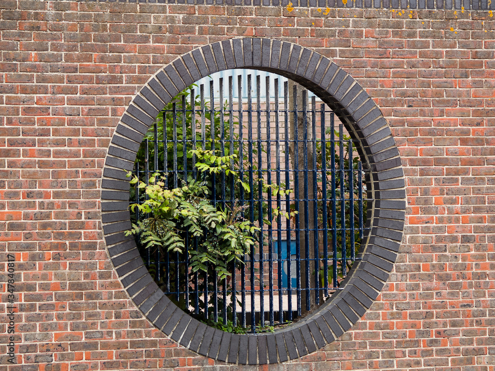 circle bars in brick wall Stock Photo | Adobe Stock