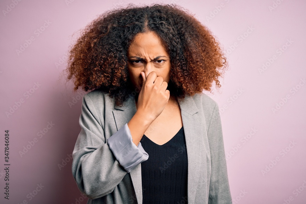 Young african american businesswoman with afro hair wearing elegant ...