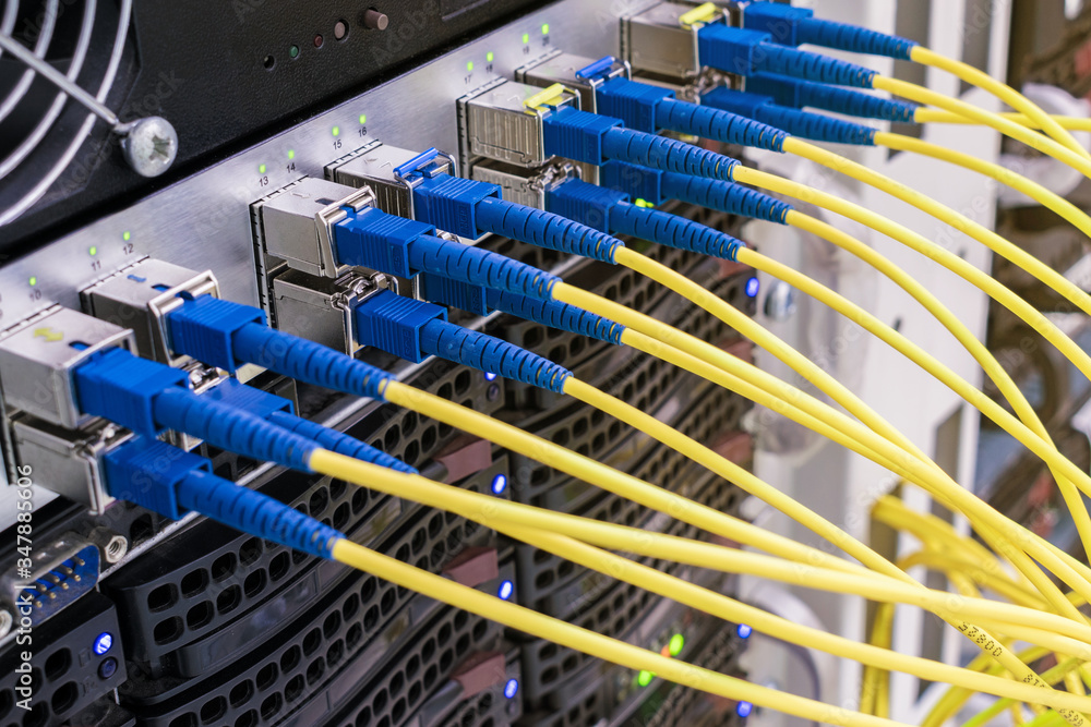 Yellow telecommunications cable in the server room of the data center ...