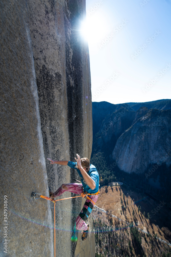 Rock climber falling on big wall while climbing the Nose el Capitan ...