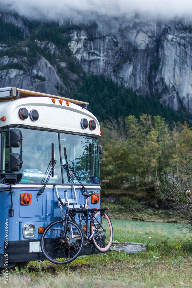 School bus converted parked front of Squamish Chief Mountain granite ...