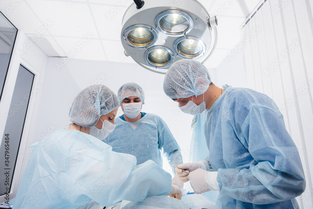 Operation in a modern operating room close-up, emergency rescue and ...