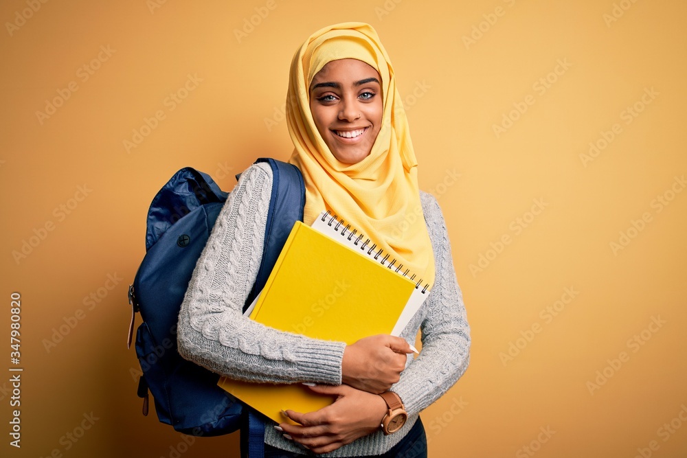 Young african american student girl wearing muslim hijab and backpack ...