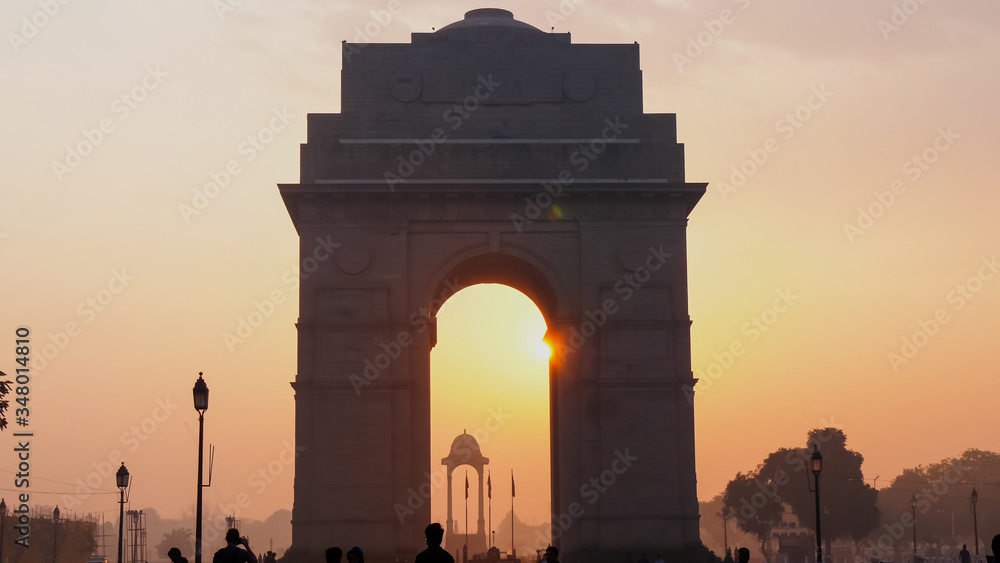 india gate at sunrise with sun lens flare at new delhi Stock Photo ...