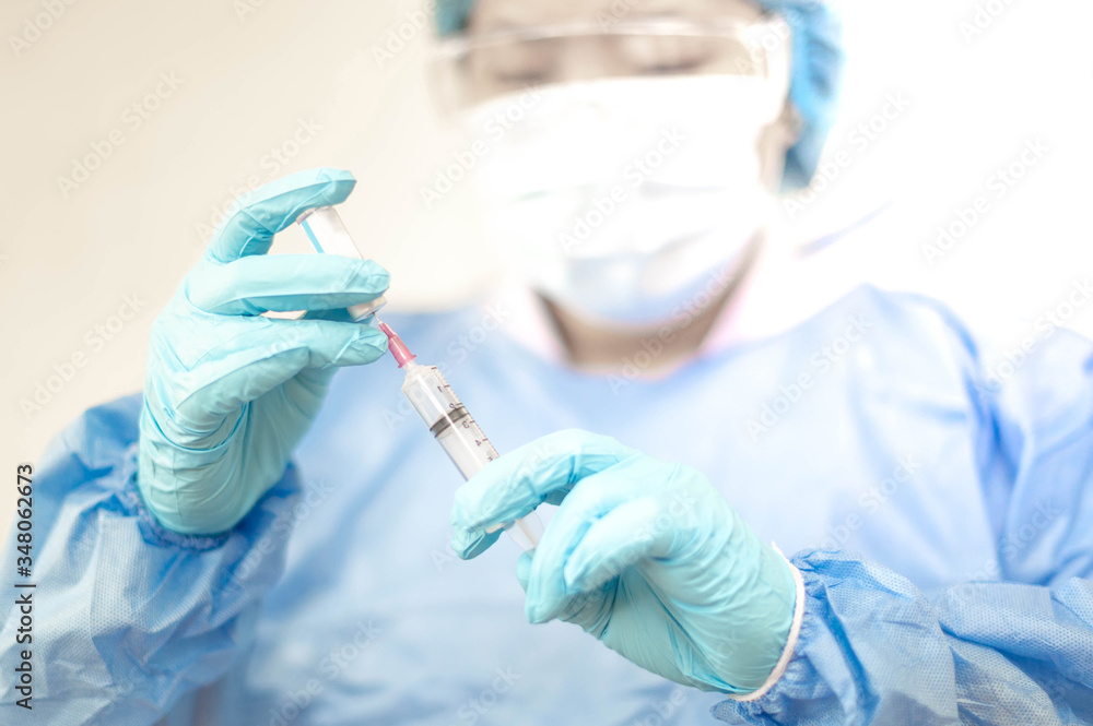 Syringe medical injection in hand holding with medicine dose ...