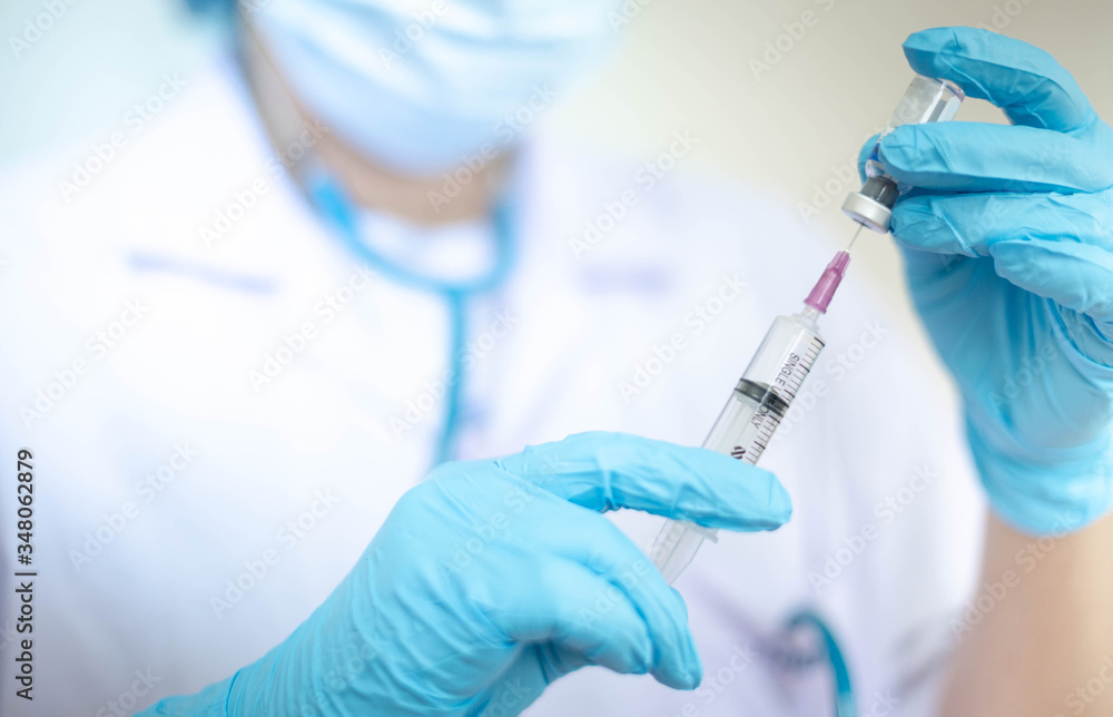 Syringe medical injection in hand holding with medicine dose ...