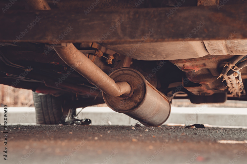 Car exhaust, muffler fallen down - view of chassis of a car Stock Photo ...