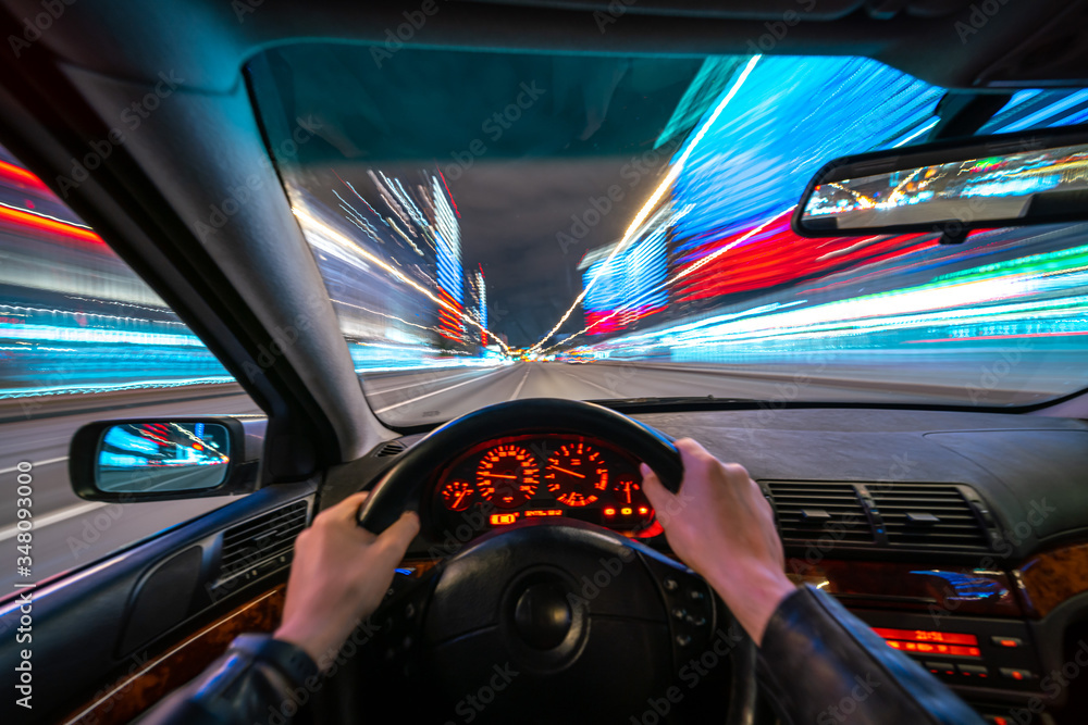 Movement of the car at night at high speed view from the interior with ...