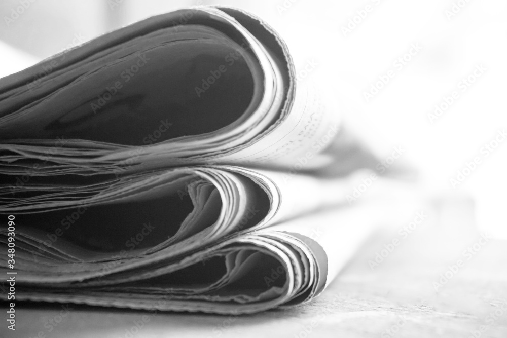 rolled up newspaper stack background Stock Photo | Adobe Stock