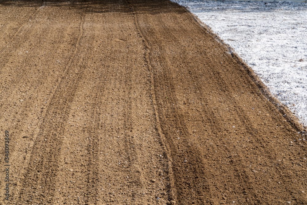 Garden lime spread on garden soil to reduce acidity and balance the ...