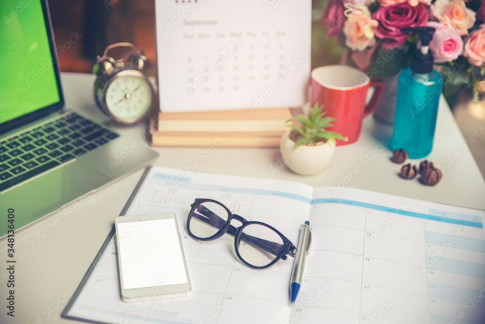 Work online from home Concept. Calendar, mobile phone, Diary, and ...