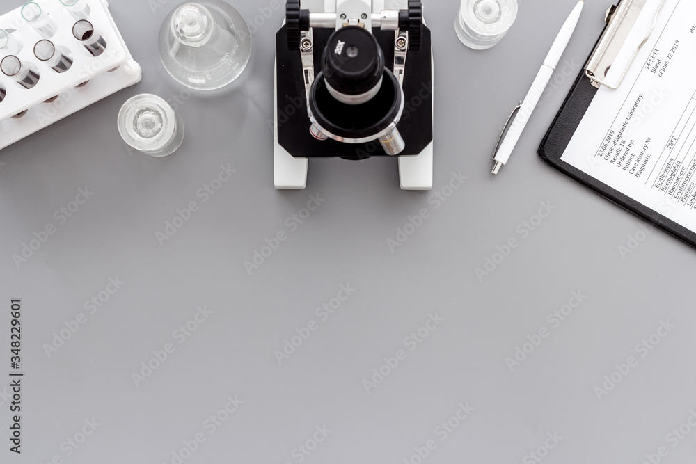 Microscope medical reserch. Blood sample for analysis. Grey table top ...