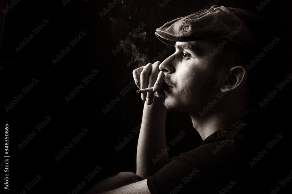 Cute young guy with moustache and a hat on smoking a cigarette. Stock ...