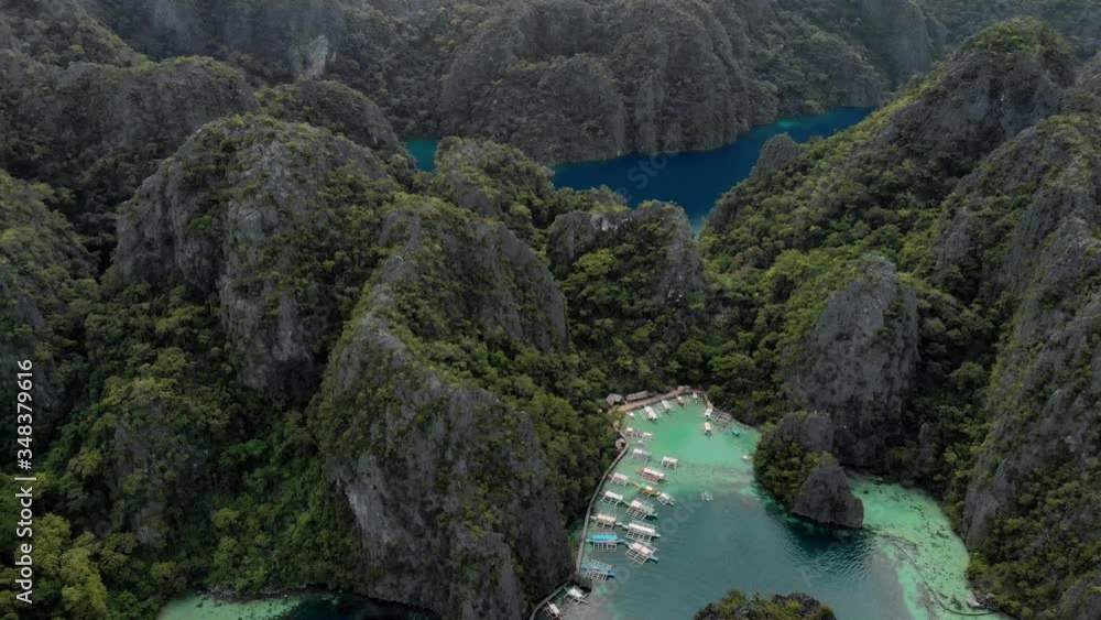 Aerial view of turquoise tropical lagoon with Karst limestone cliffs in ...