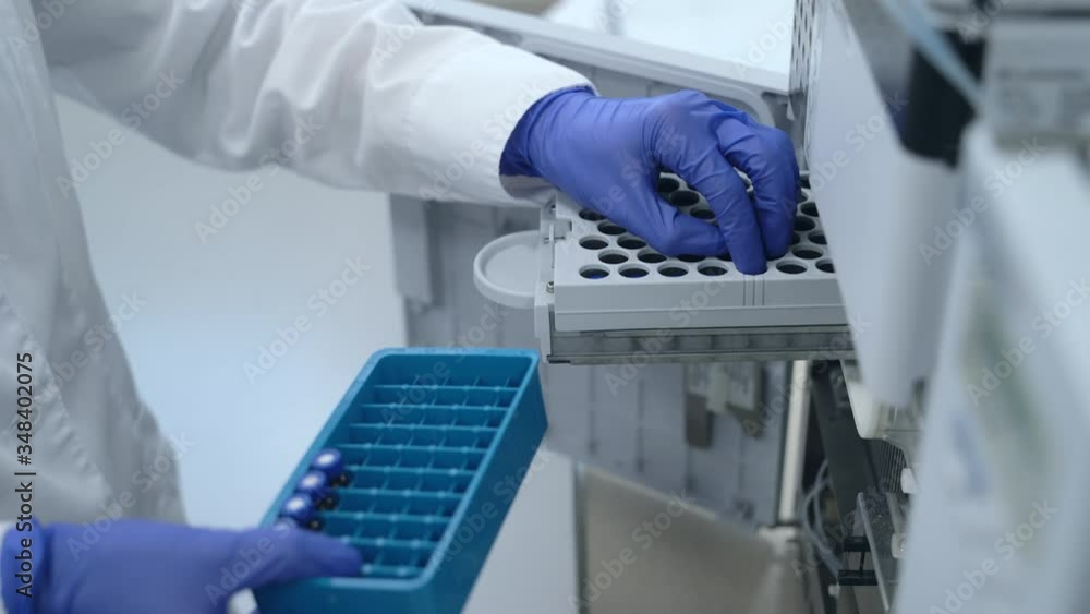 scientist hand putting test tubes ampoules bottles in pcr machine Spbas ...