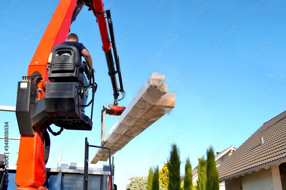 Truck Delivering Wood Packages which will be using for built a carport ...