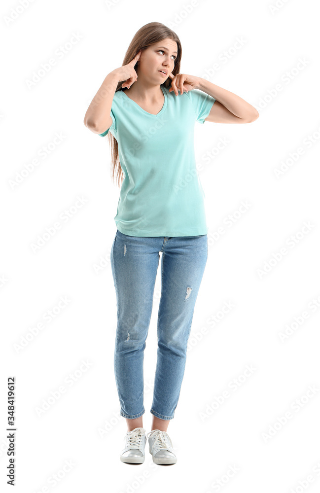 Young woman suffering from loud noise on white background Stock Photo ...