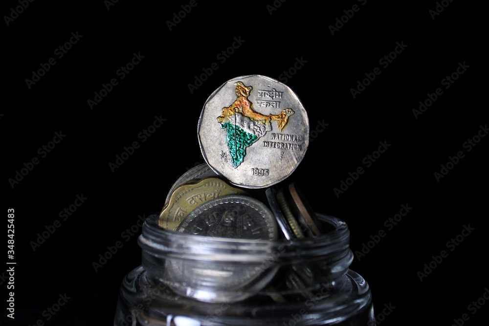 Two rupee coin of India isolated on black background. Map of India as a ...